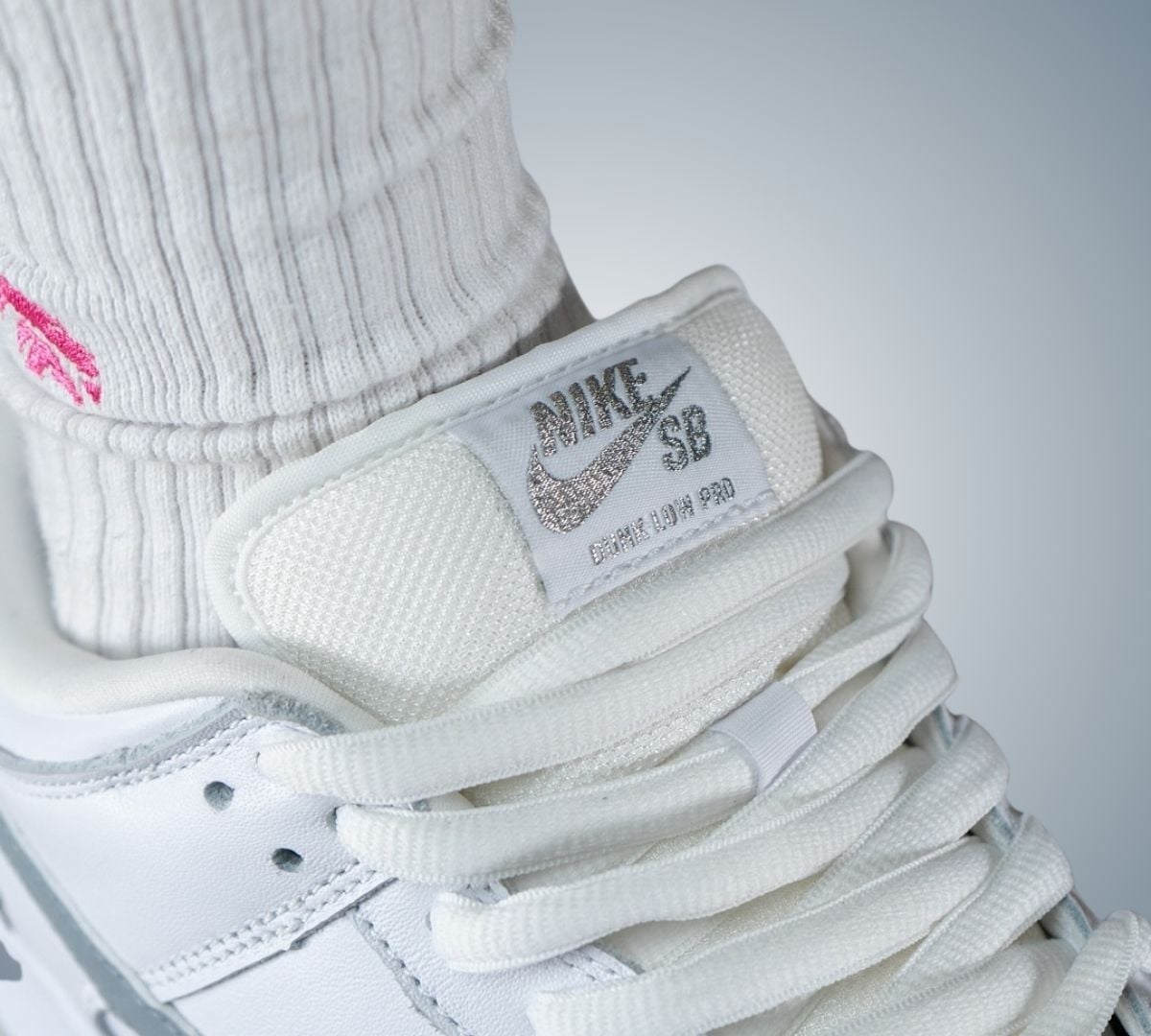 Supreme x Nike SB Dunk Low White Metallic Silver HQ8487-100 | SneakerFiles