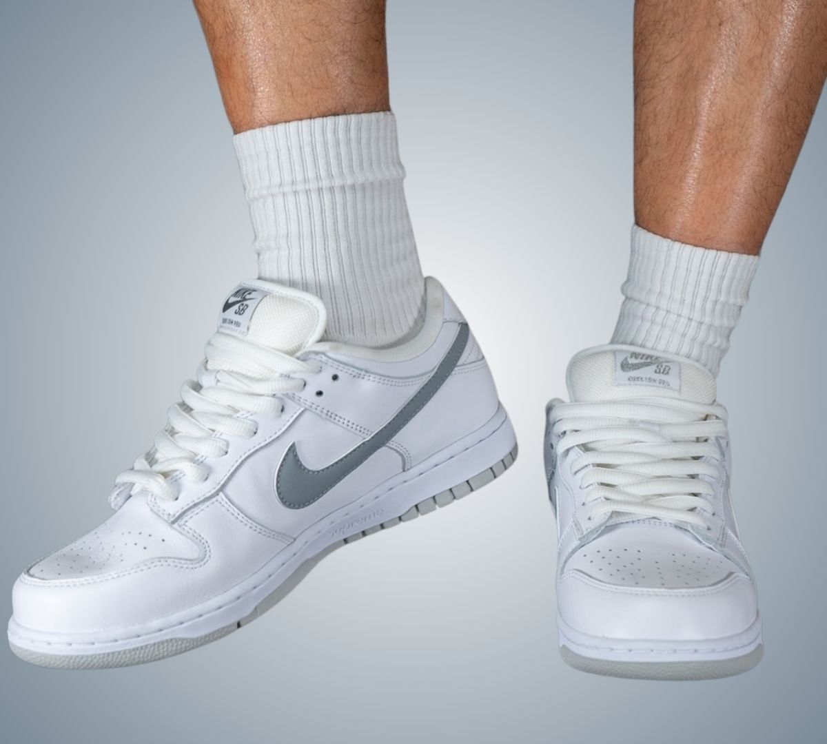 Supreme x Nike SB Dunk Low White Metallic Silver HQ8487-100 | SneakerFiles
